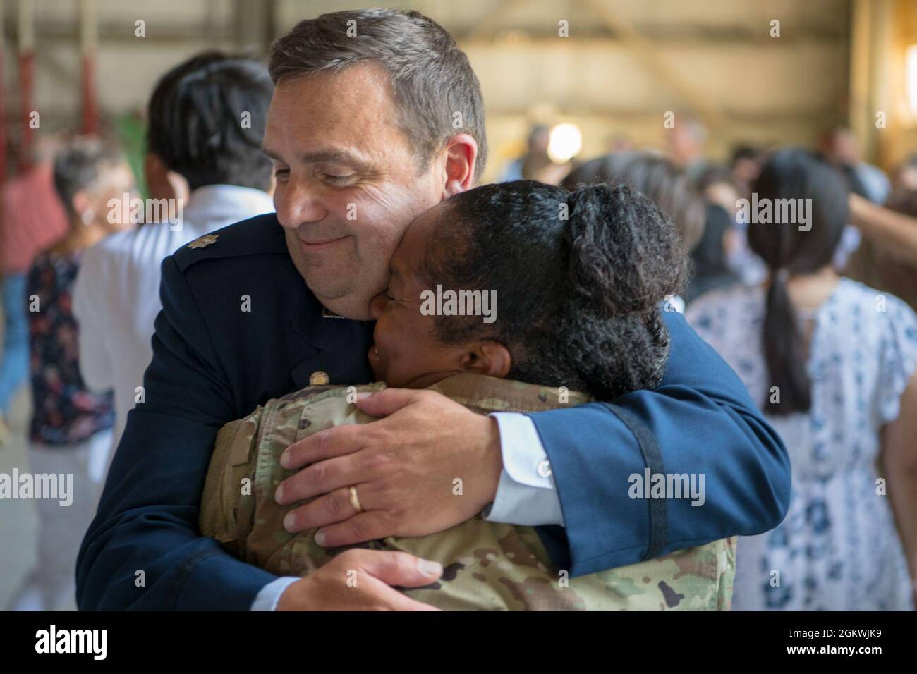 Senior Master Sgt. Gaylen Clemon embraces Lt. Col. Carlton Thompson ...