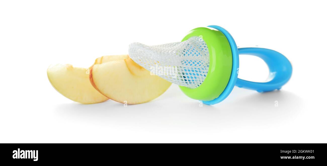 Baby's nibbler and ripe apple on white background Stock Photo - Alamy