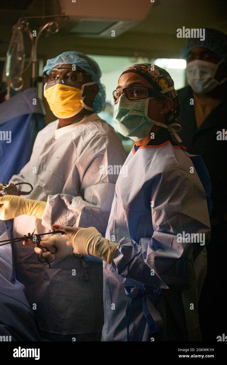 U.S. Navy Lt. Cmdr. Marissa Mayor, right, with Fleet Surgical Team 7 ...