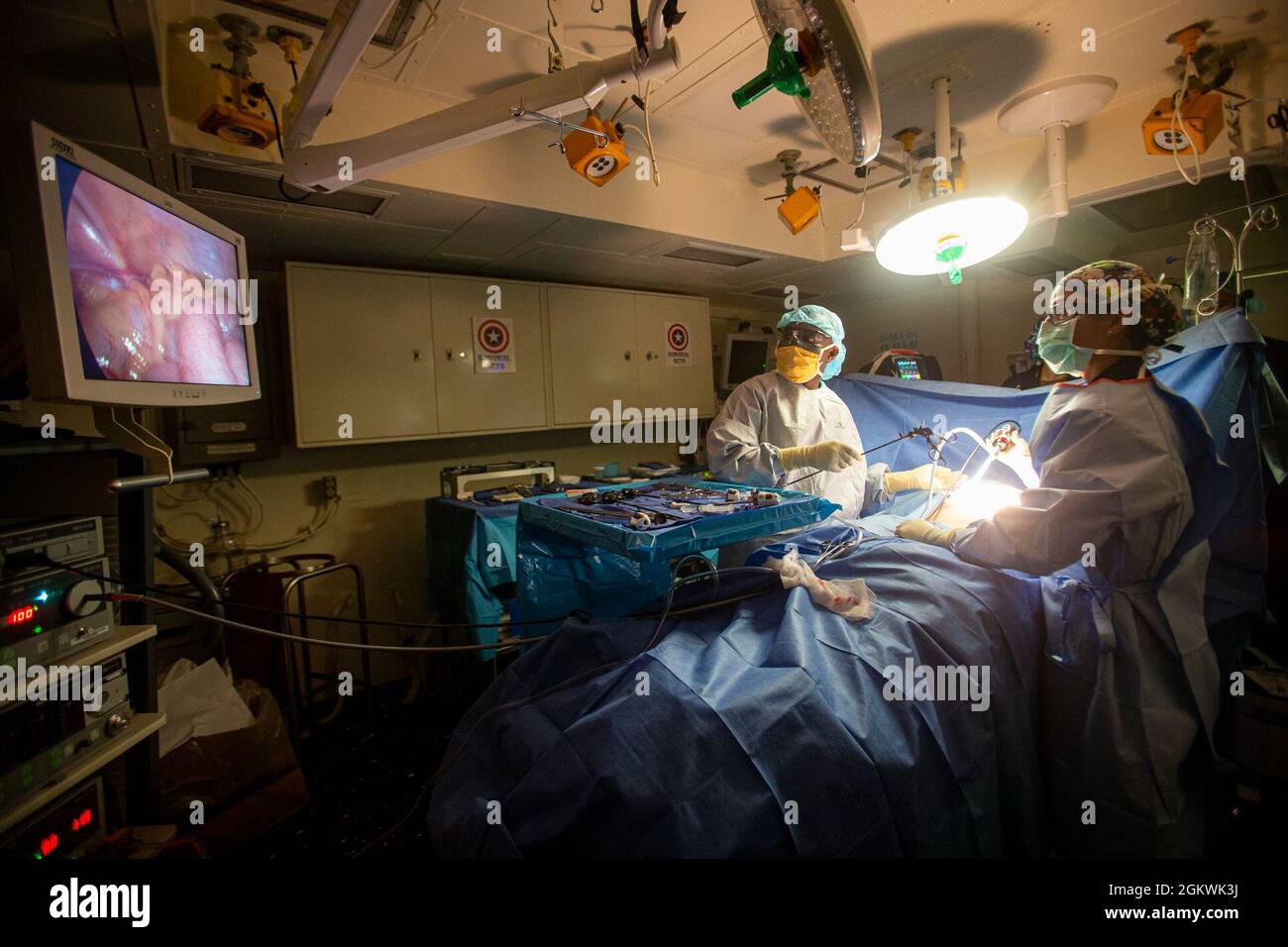 U.S. Navy Sailors with Fleet Surgical Team 7 identify the appendix ...