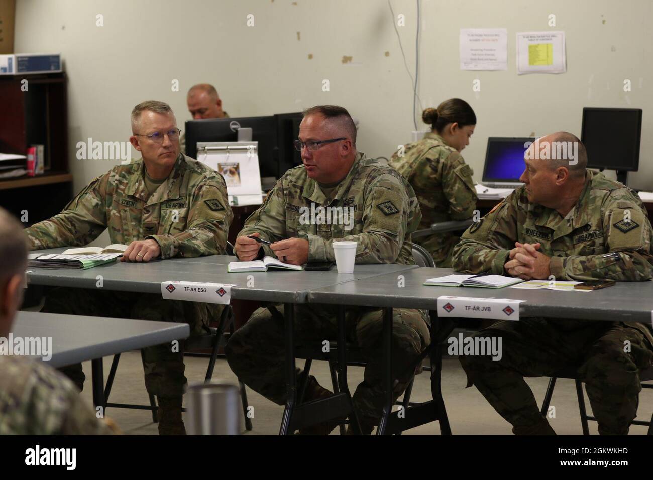 Col. Joel Lynch, Lt. Col. Brian Wheeler, both JFHQ listen to Maj ...