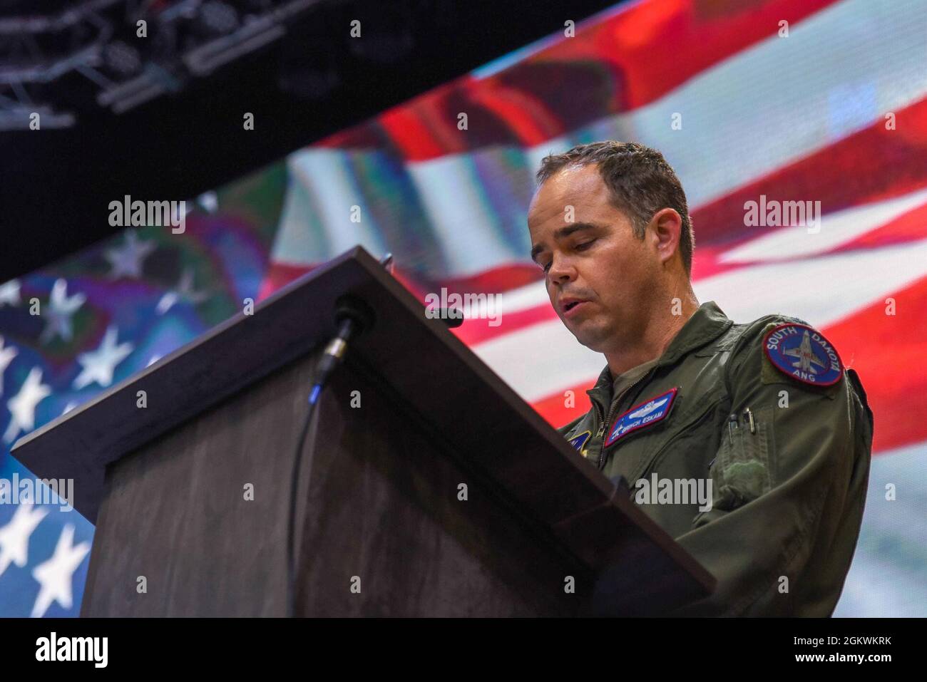Col. Brandon Eskam, 114th Fighter Wing vice commander, speaks during a ...
