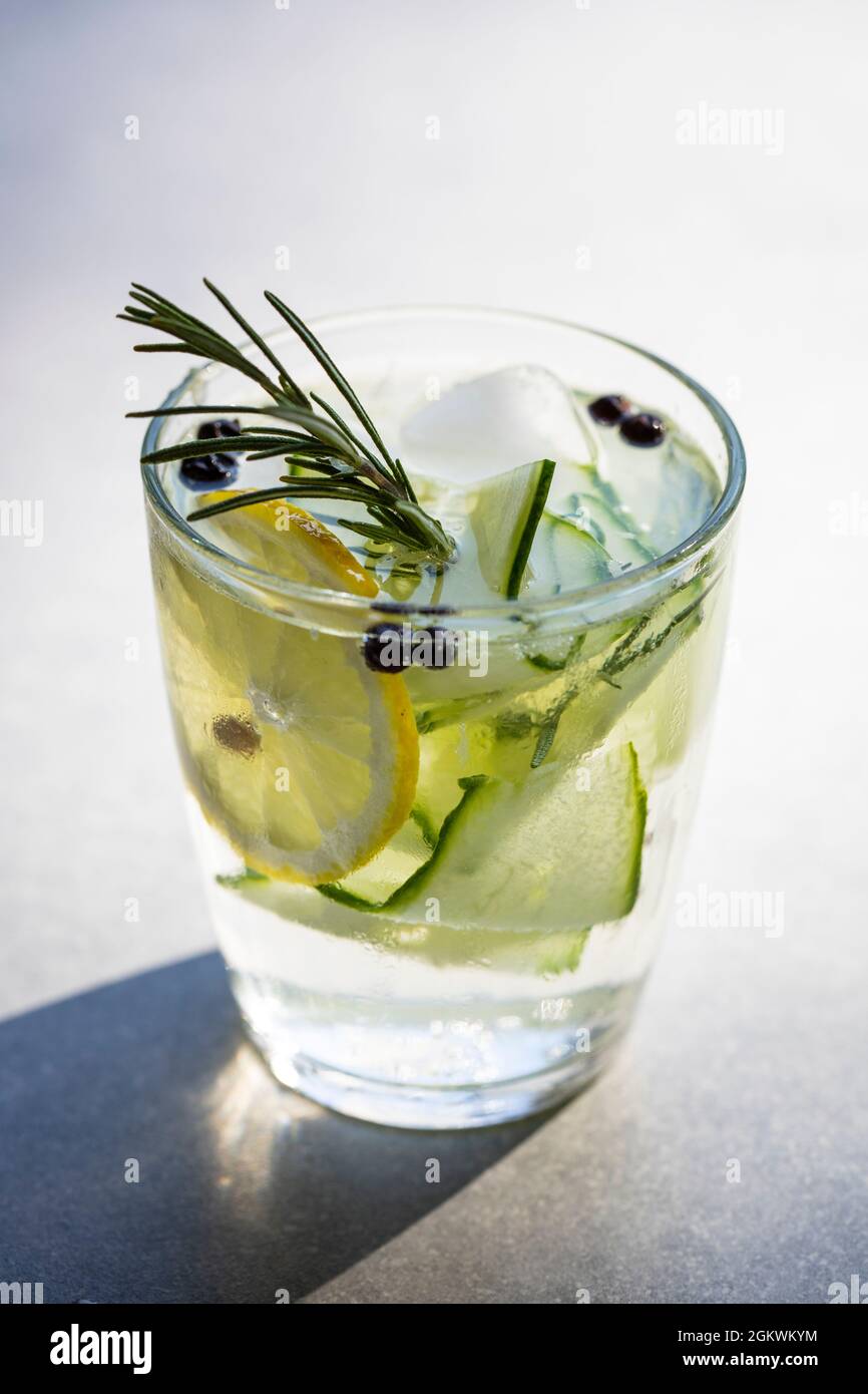 Gin and tonic with cucumber, juniper berries and rosemary Stock Photo ...