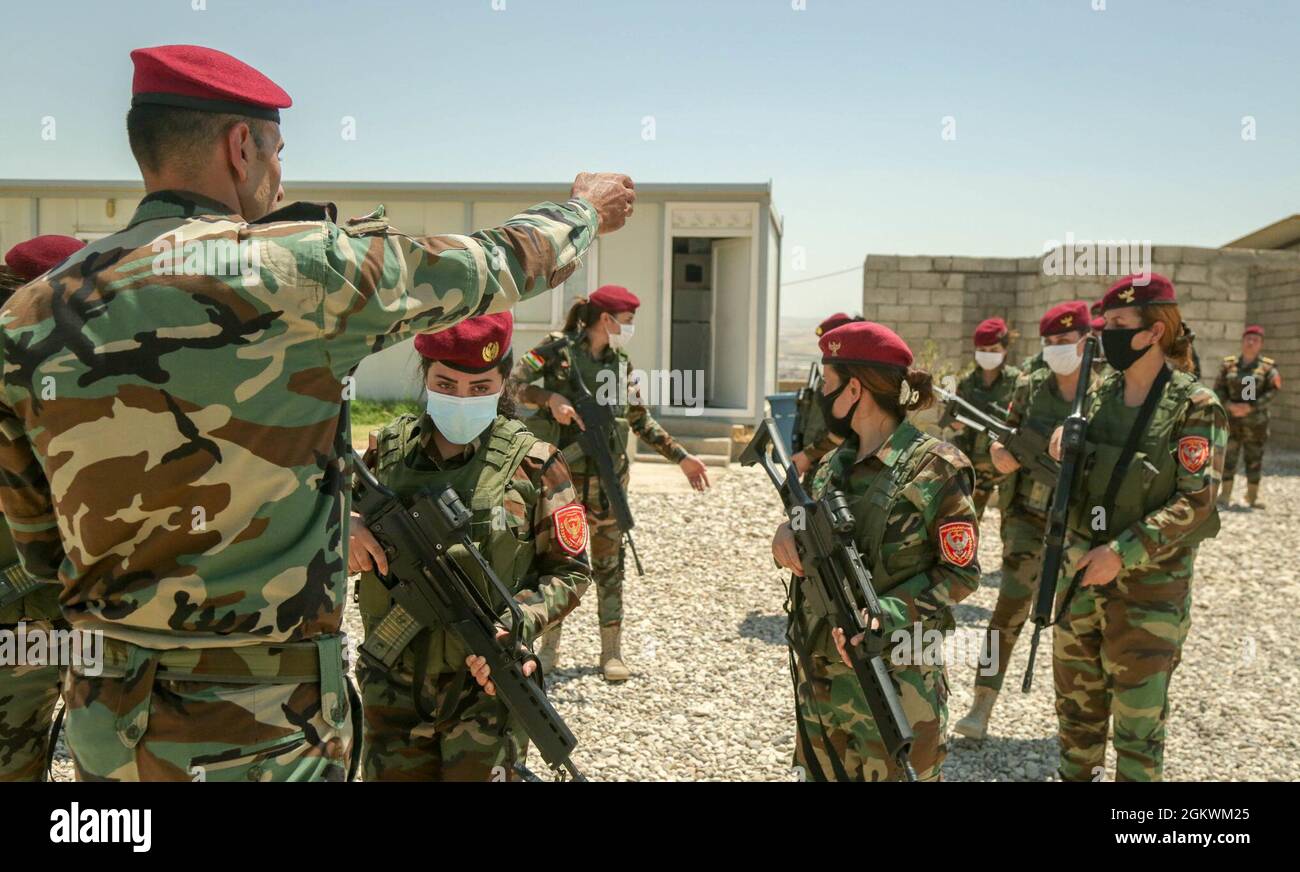 Peshmerga female soldiers run through squad movement drills at the ...