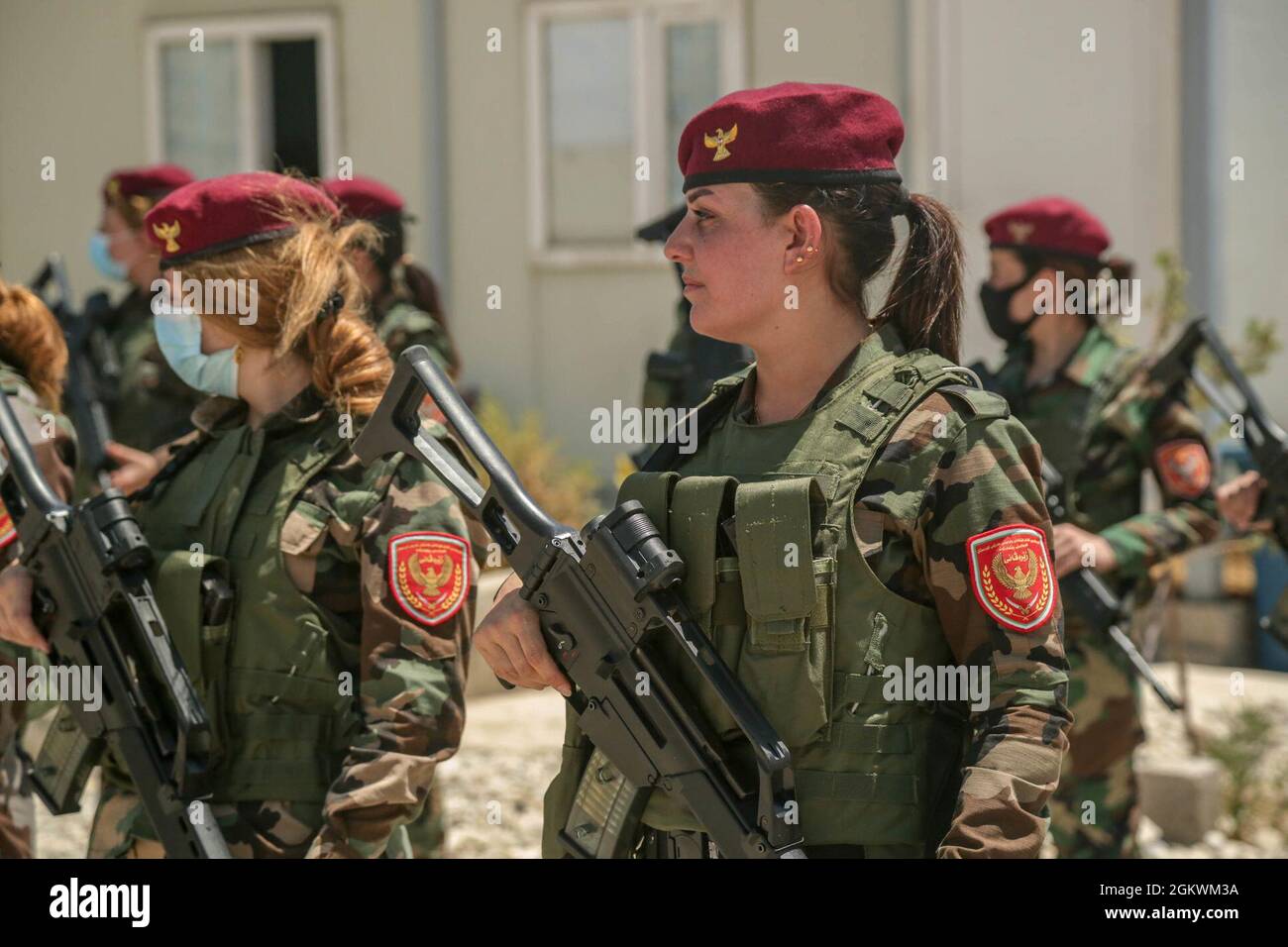 Peshmerga female soldiers run through squad movement drills at the ...