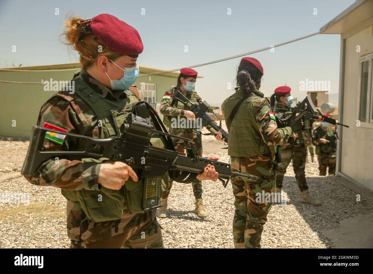 Peshmerga female soldiers run through squad movement drills at the ...
