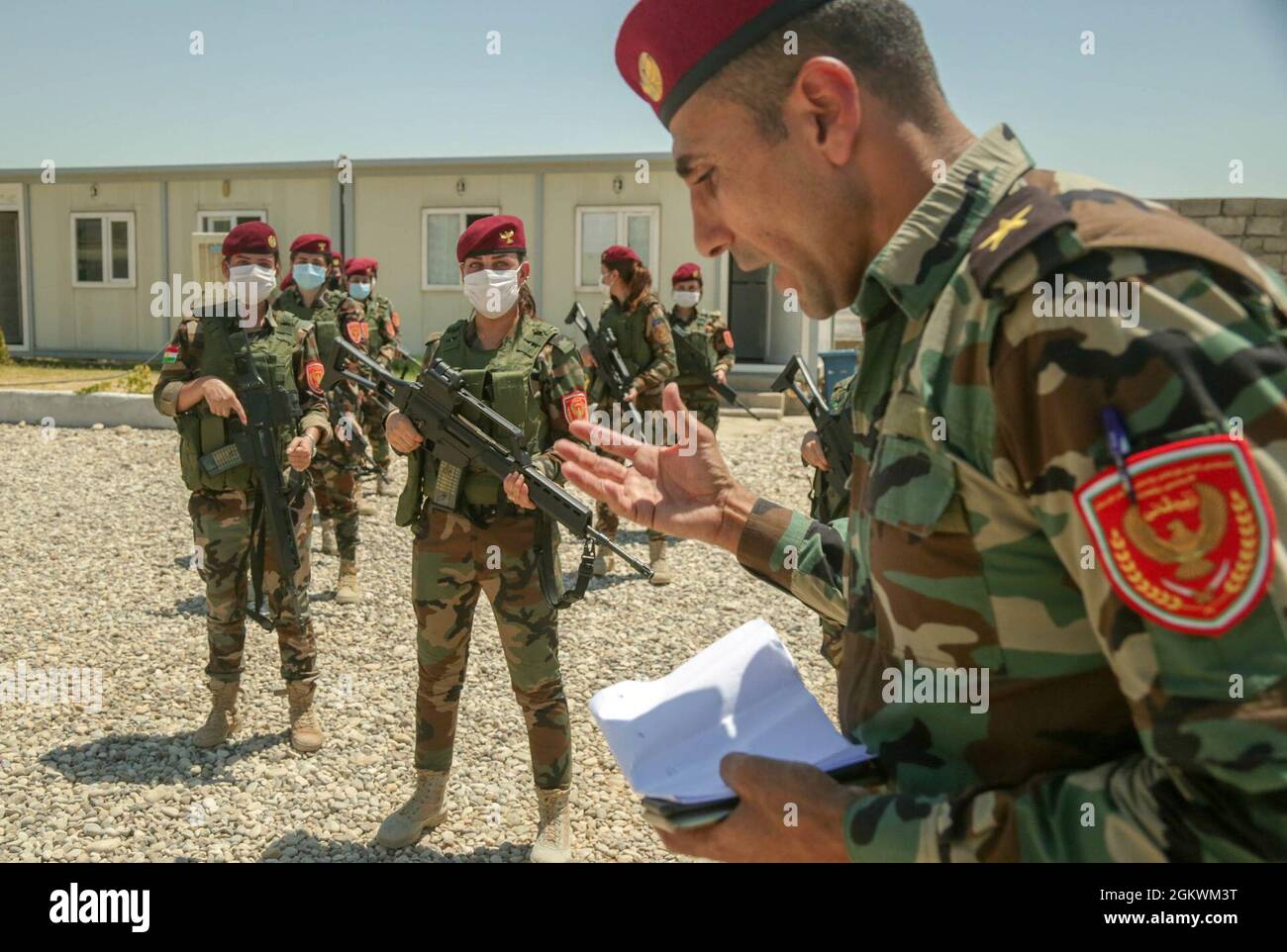 Peshmerga female soldiers run through squad movement drills at the ...