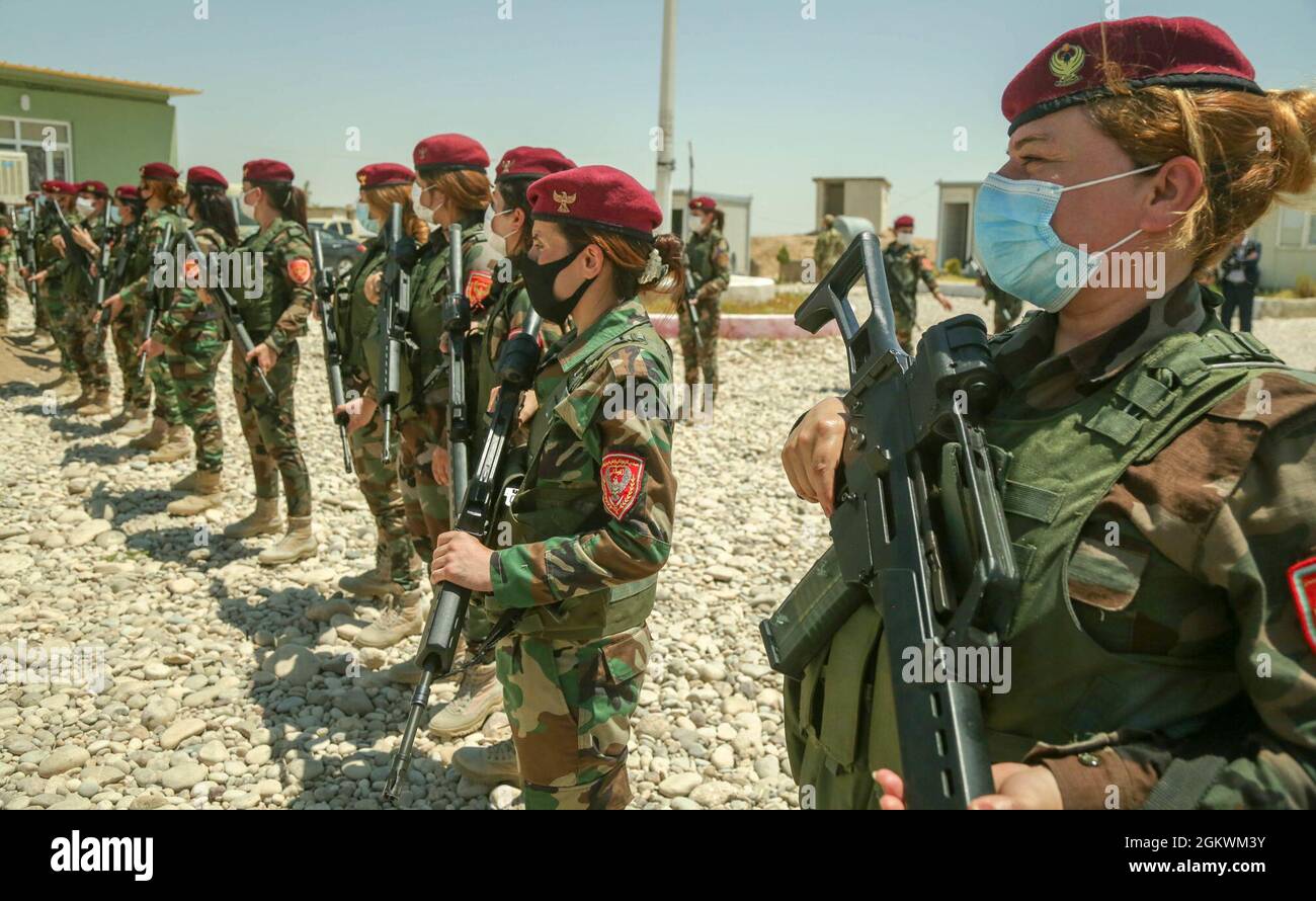 Peshmerga female soldiers run through squad movement drills at the ...
