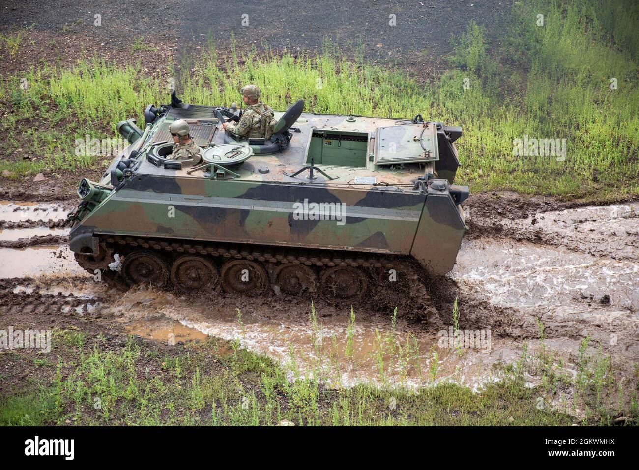 Soldiers from the Arizona Army National Guard's 819th Sappers drive an ...