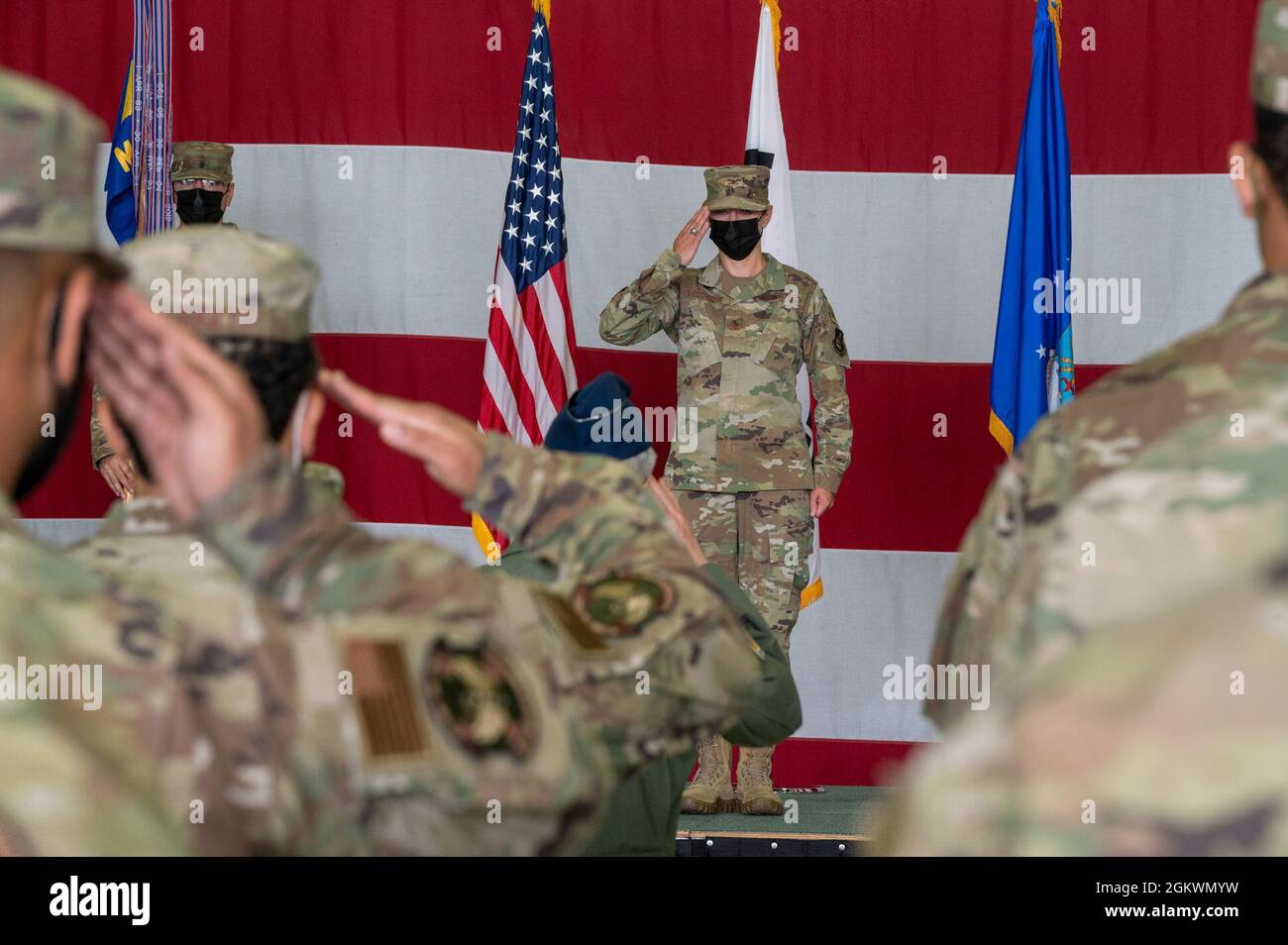 Col. Jennifer Vecchione, 51st Medical Group commander, returns a salute ...