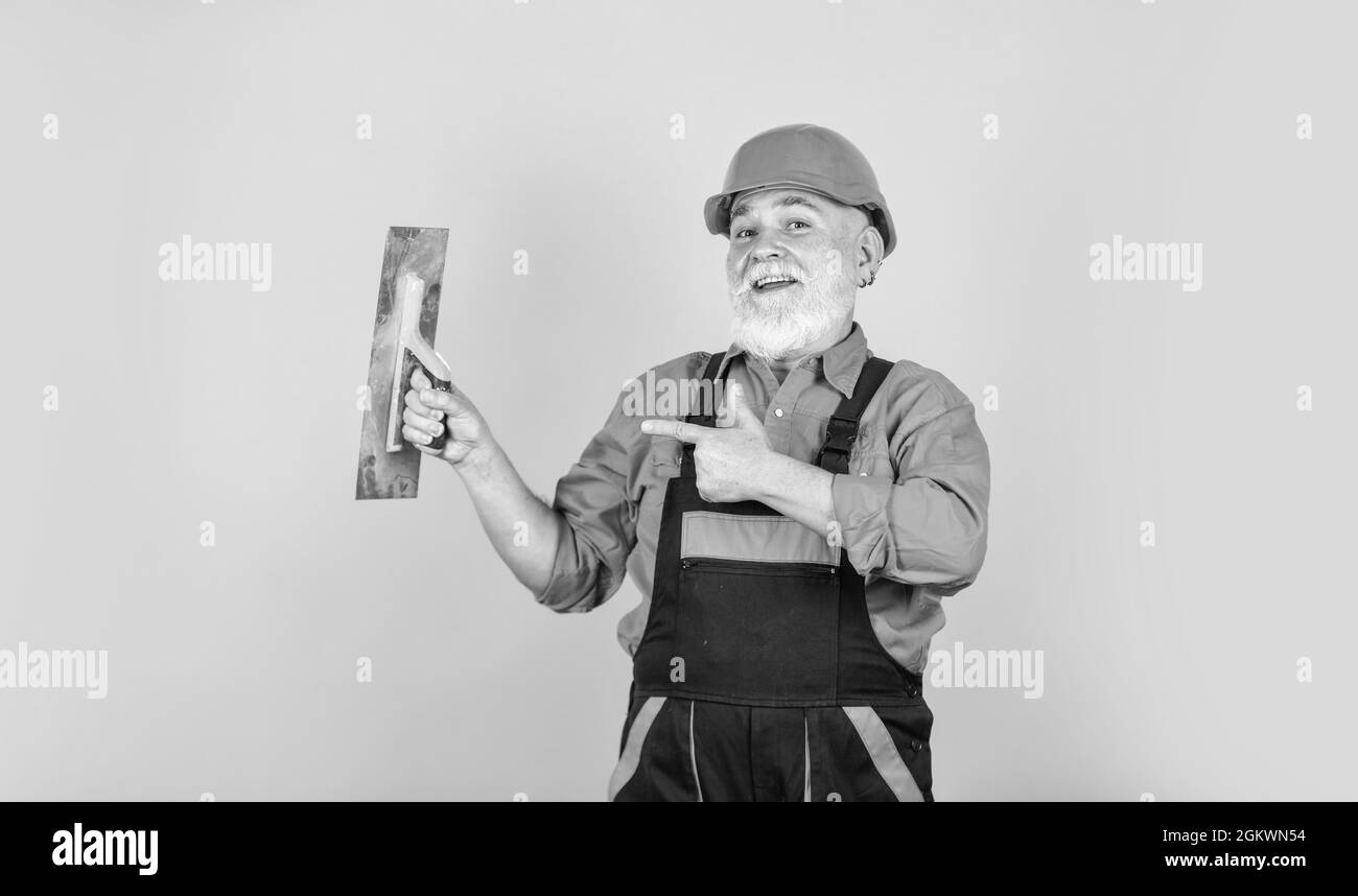 process of applying layer of putty. Plastering tools for plaster ...