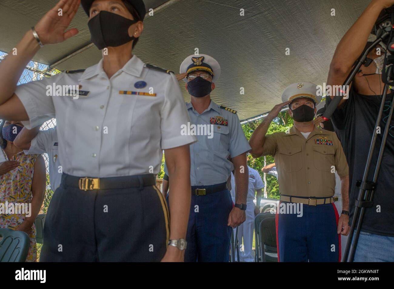 Marine Corps Base (MCB) Camp Blaz senior leaders render a salute during ...