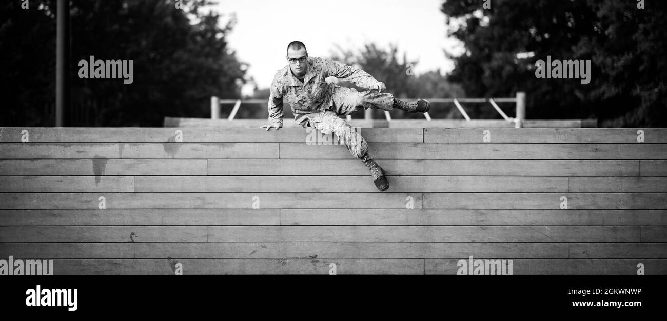 U.S. Marine Corps officer candidates with Alpha Company run through the ...