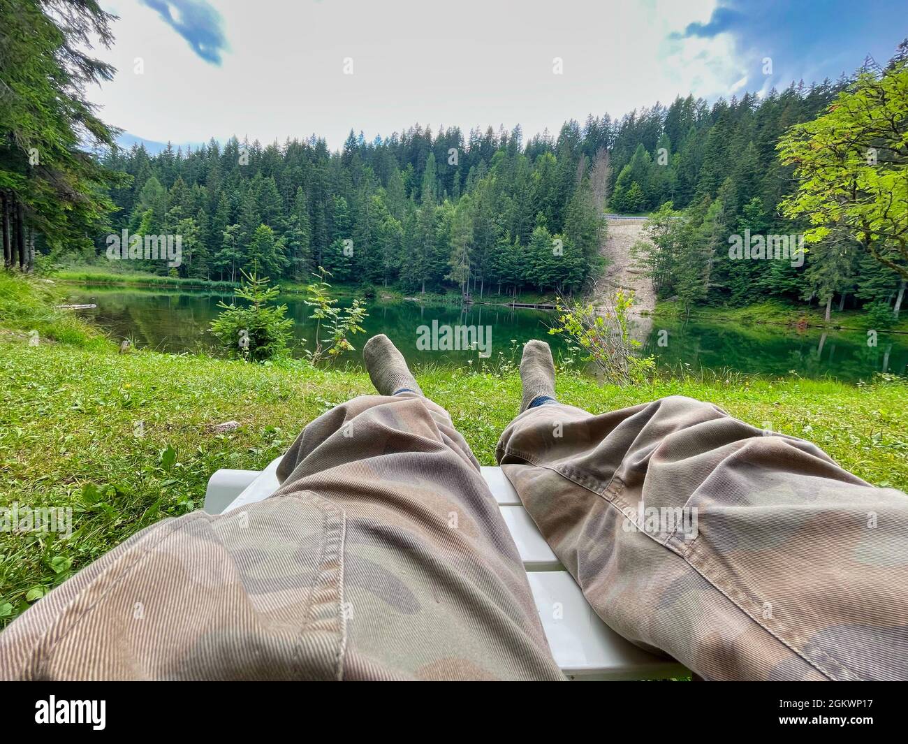 Lying man legs with a beautiful green landscape in the background Stock ...