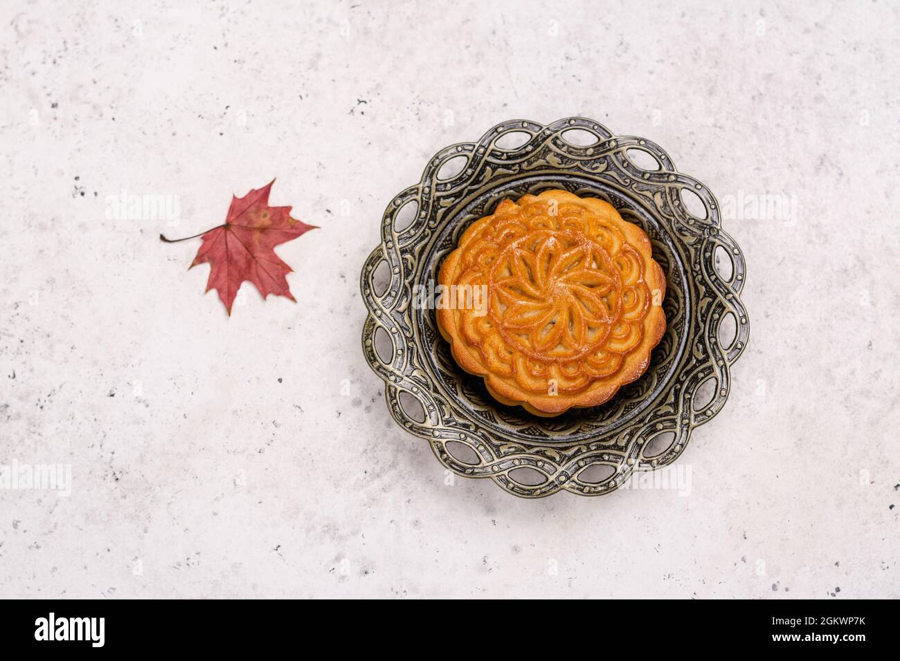 Traditional chinese yuebing cake - moon cake and maple leaf on light ...