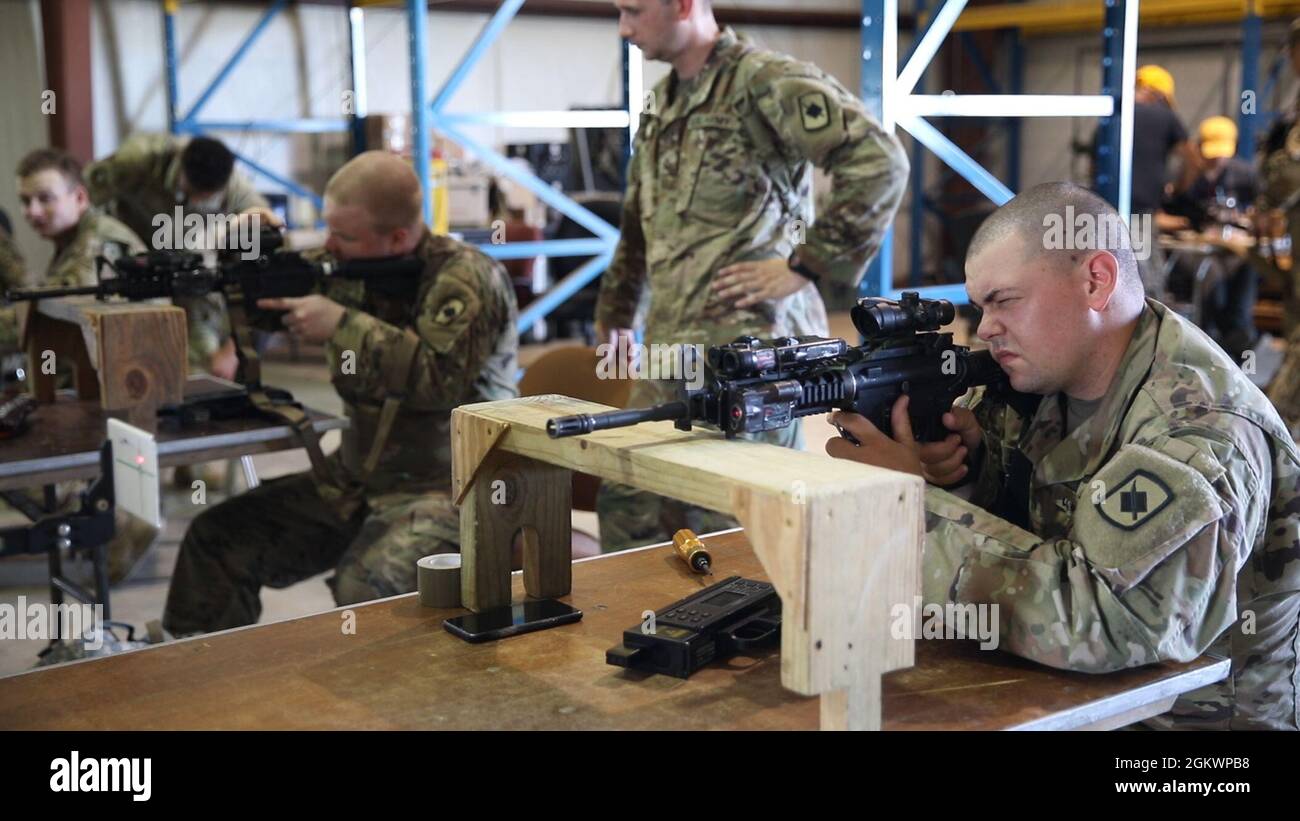 Spc. Nathan Pulliam (Right) aligns and zeros the multiple integrated ...