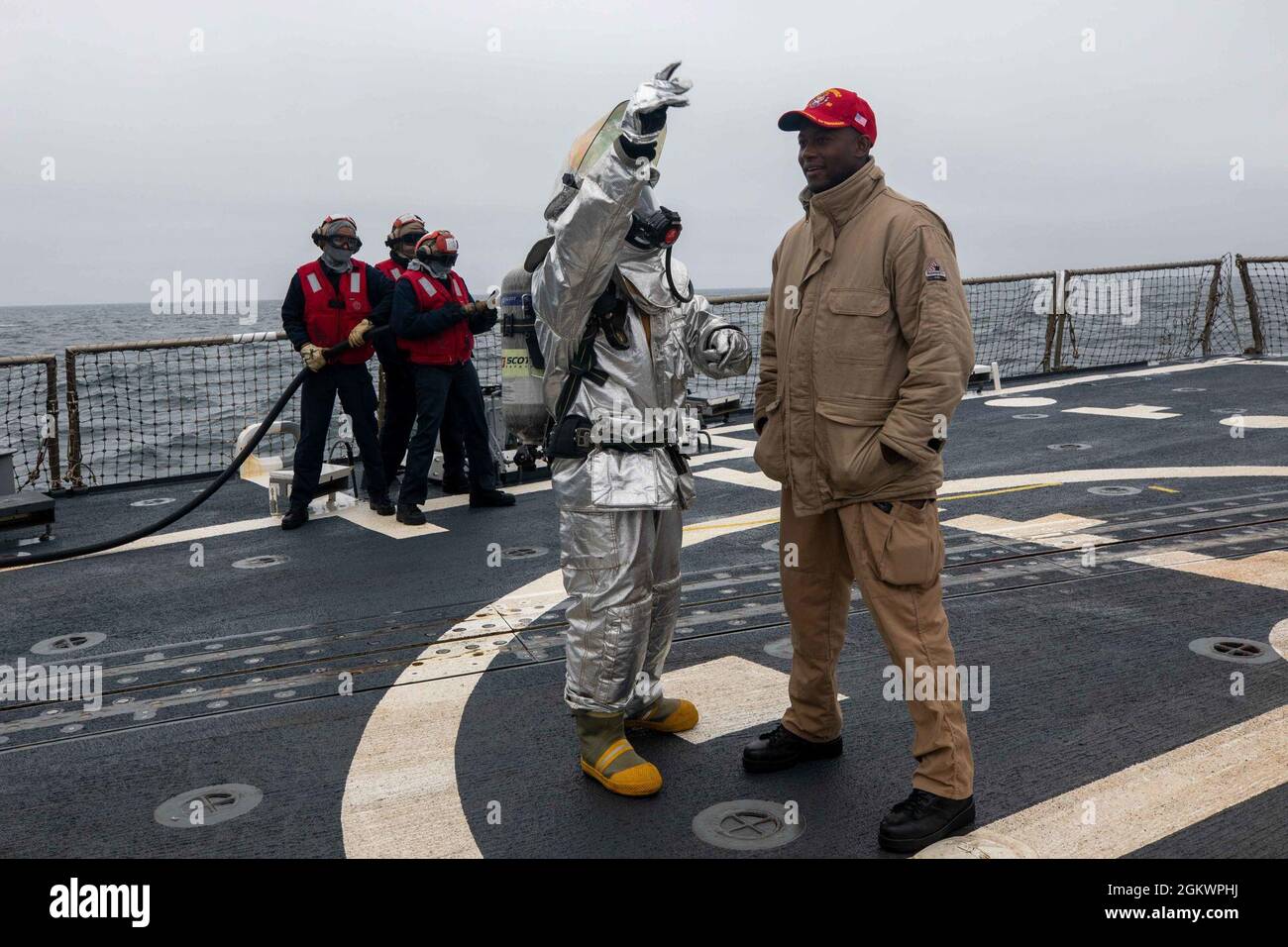 ARCTIC OCEAN (July 12, 2021) Yeoman 2nd Class Renato Tanamachi, center ...