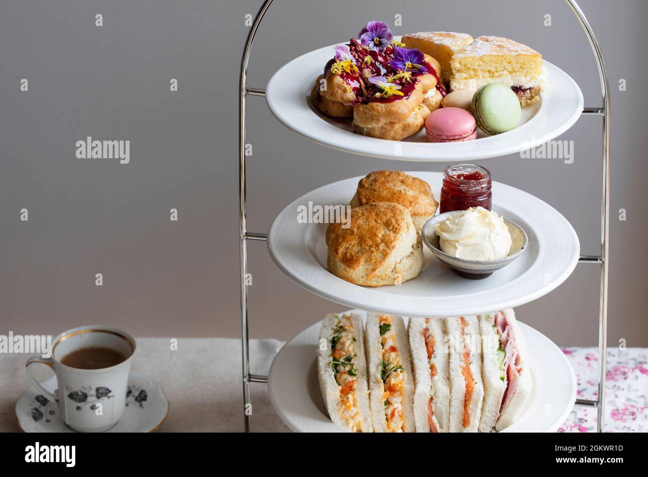 Afternoon tea with cakes, scones and sandwiches Stock Photo - Alamy