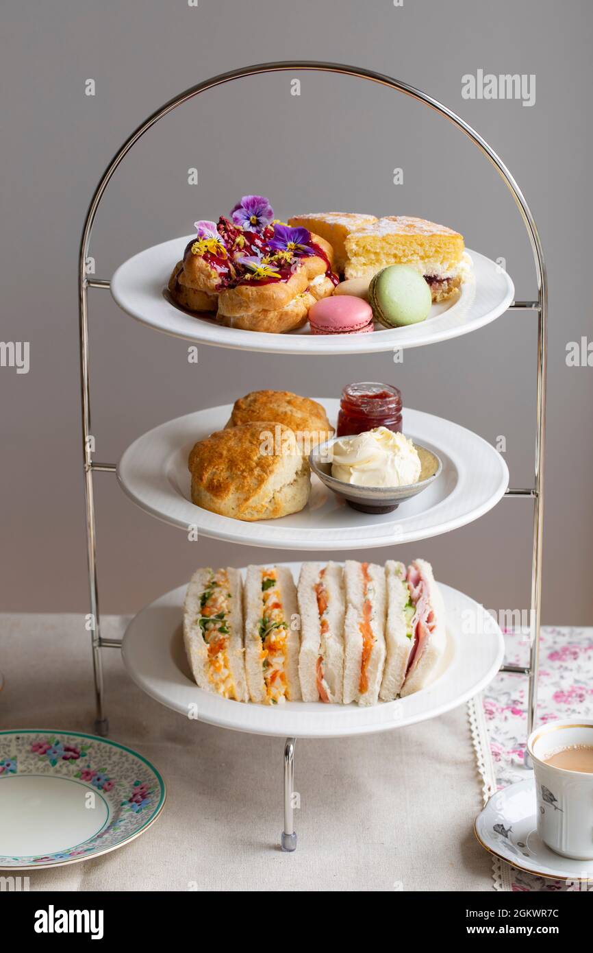 Afternoon tea with cakes, scones and macaroons Stock Photo - Alamy