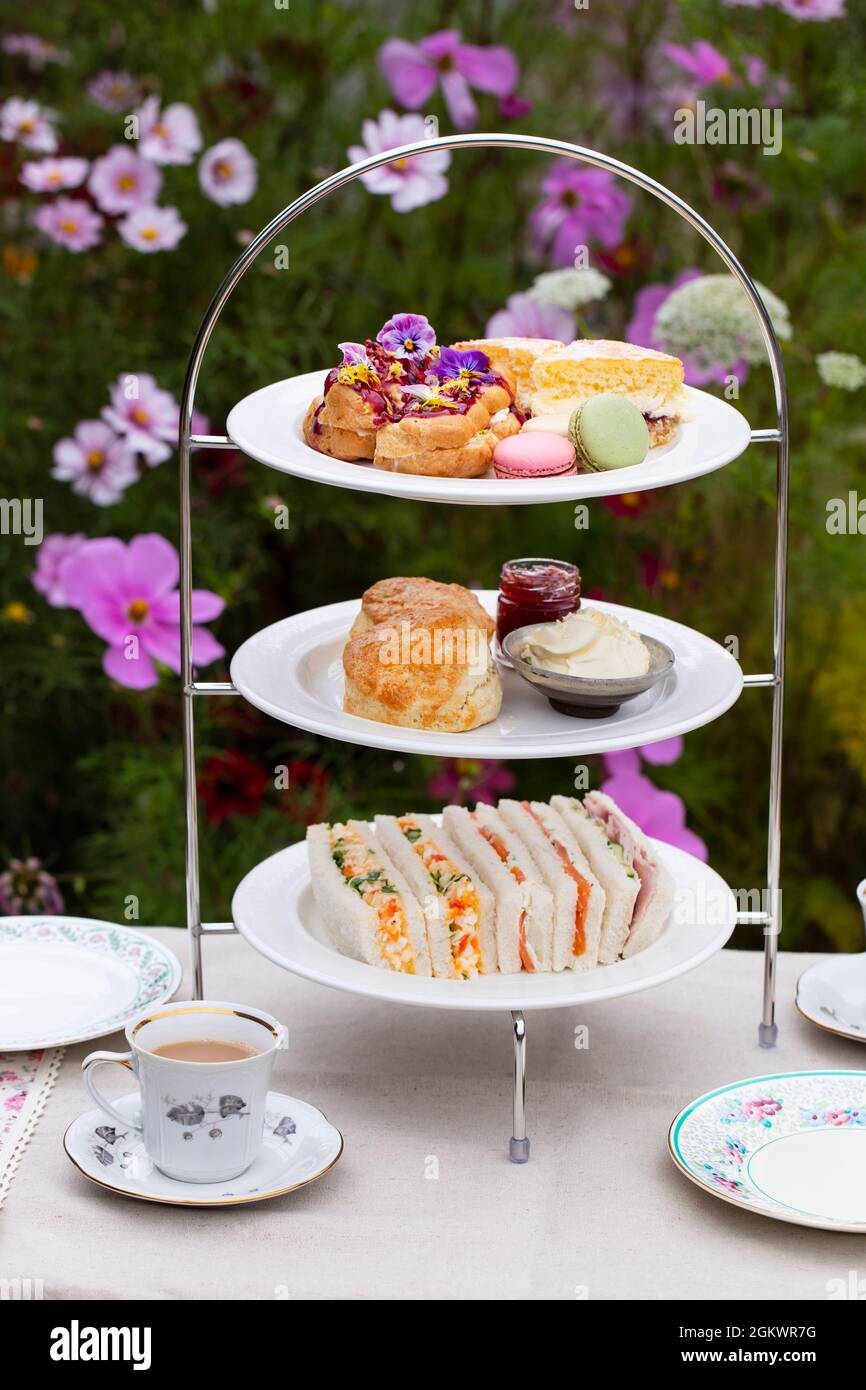 Afternoon tea with cakes, scones and sandwiches Stock Photo - Alamy