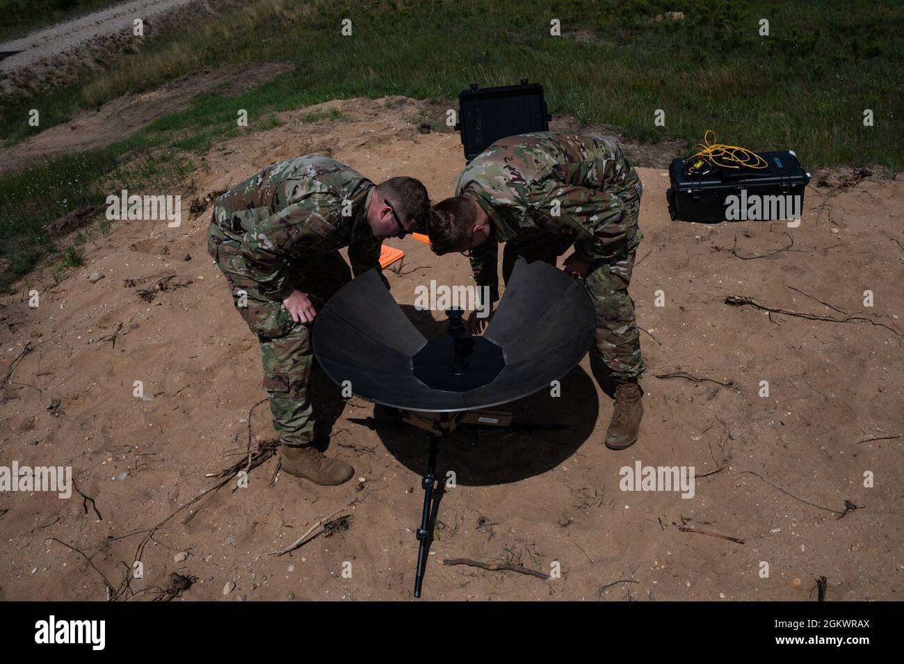 U.S. Air Force Tech Sgt. Peter Thompson, left, 1st Combat Camera ...