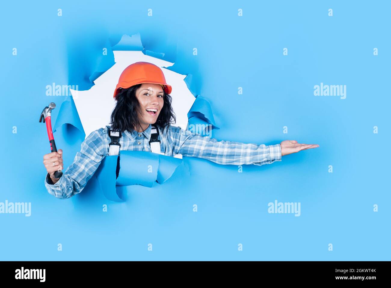 female foreman on construction site. carpenter assistant wear ...