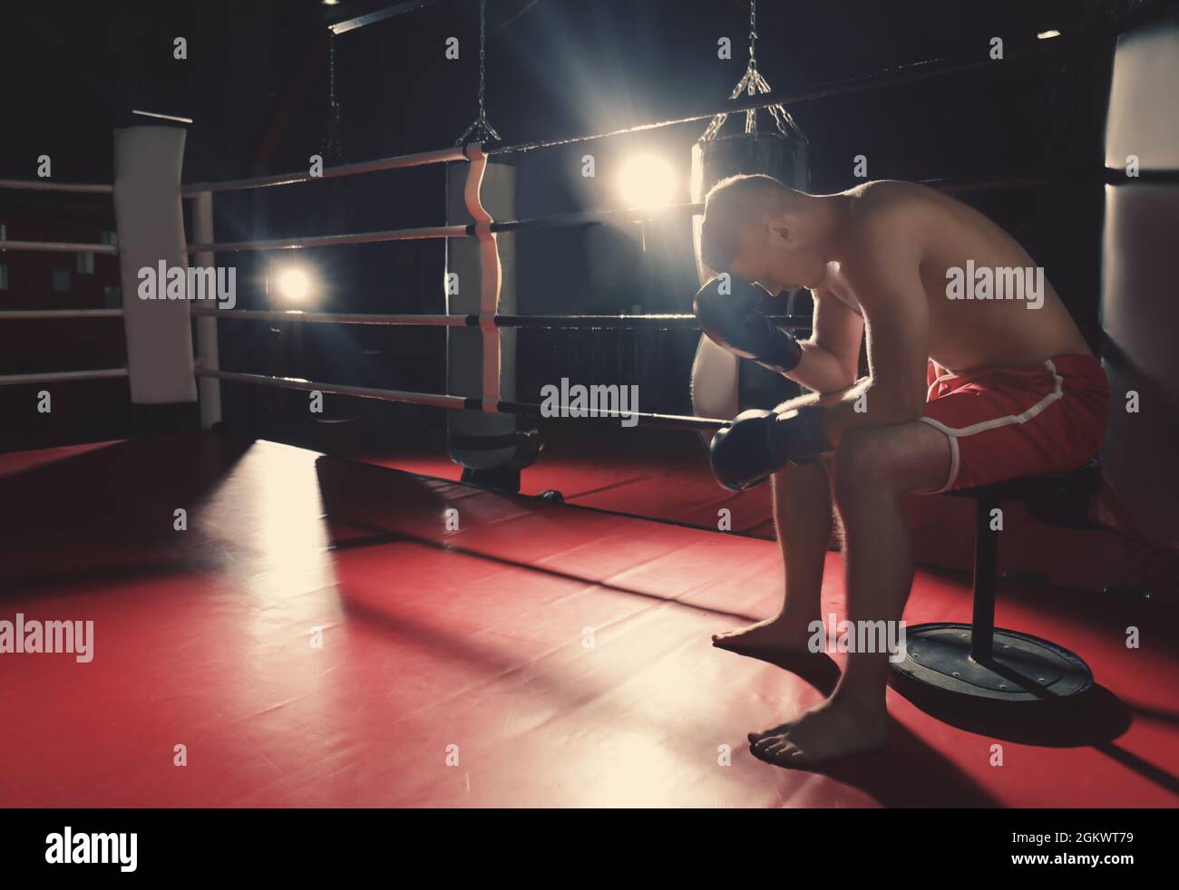Professional boxer having break during training Stock Photo - Alamy