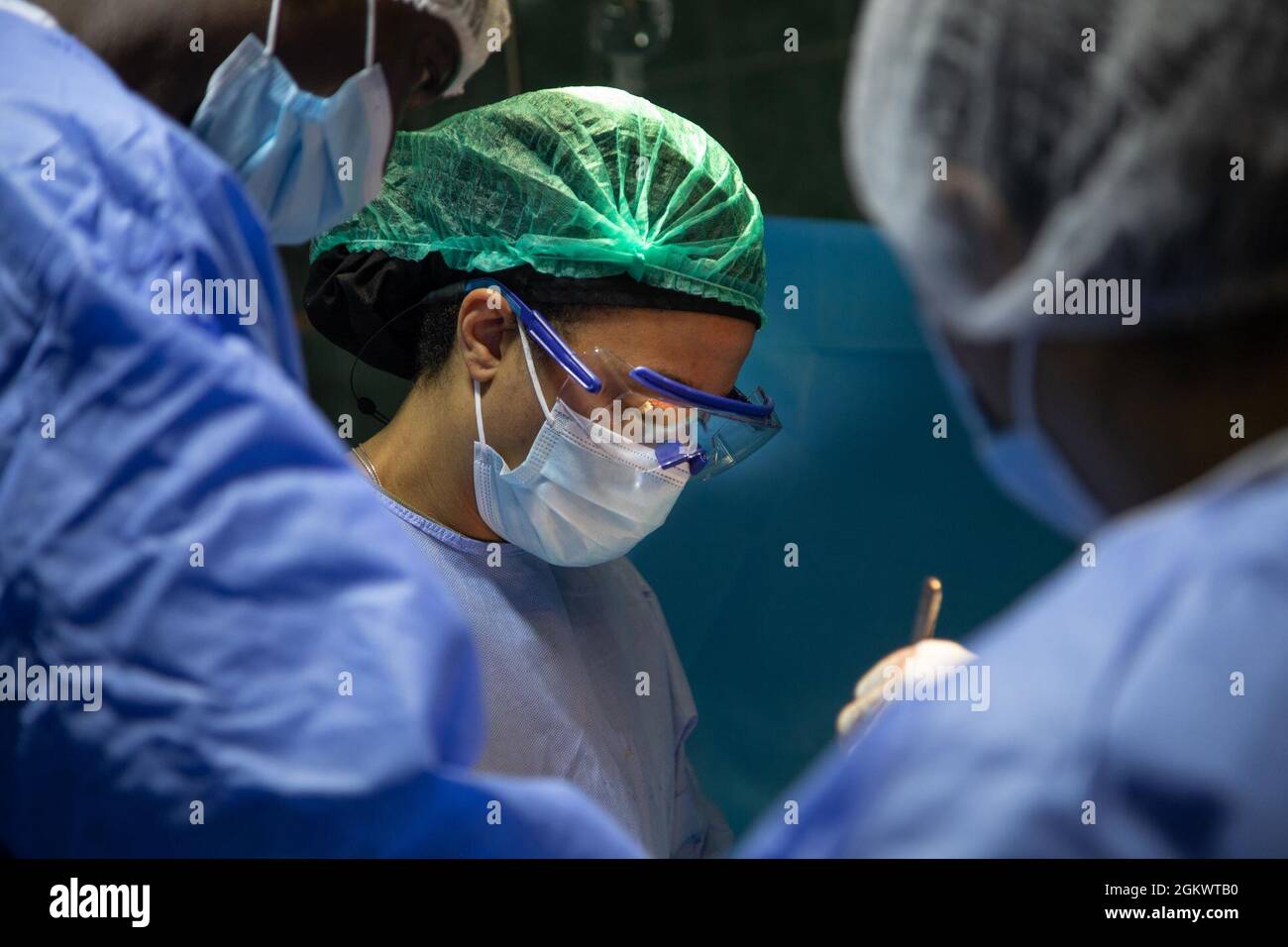 U.S. Army Maj. Tuesday Fisher, orthopedic surgeon, conducts a partial ...