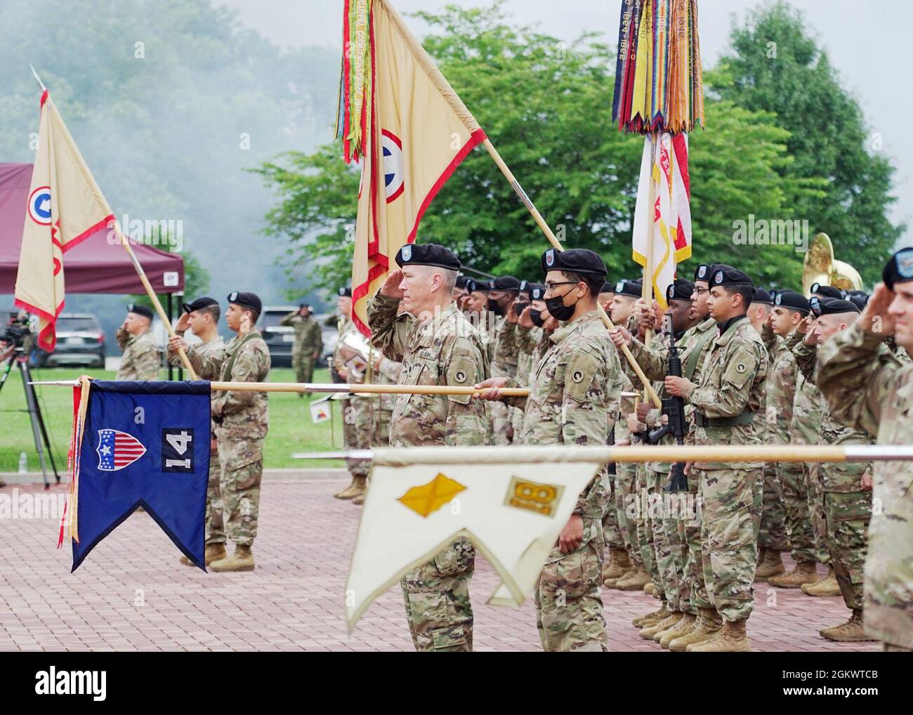 Soldiers of the 1st Theater Sustainment Command render a salute during ...