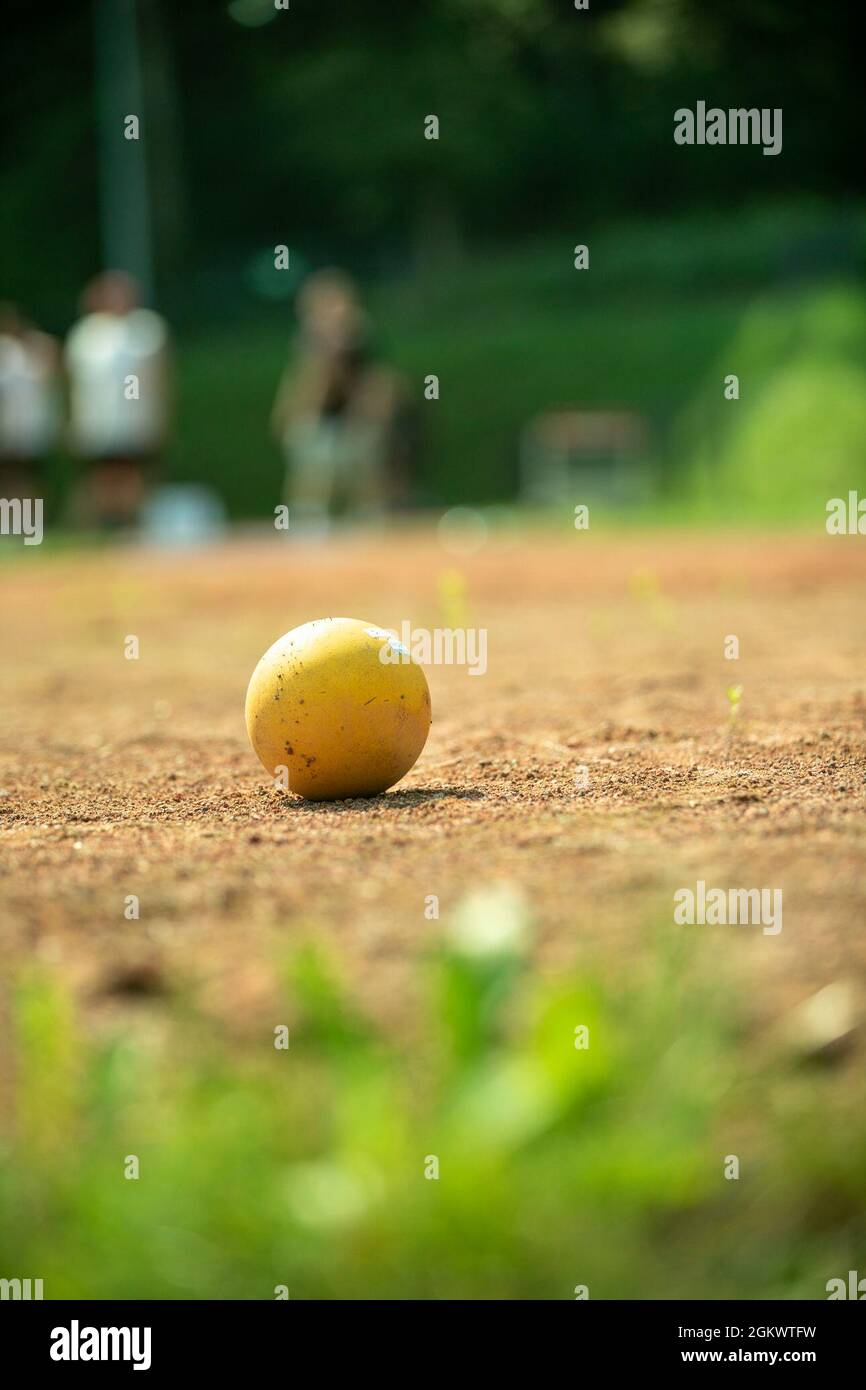A shot put ball lies in the dirt during the shot put competition at ...