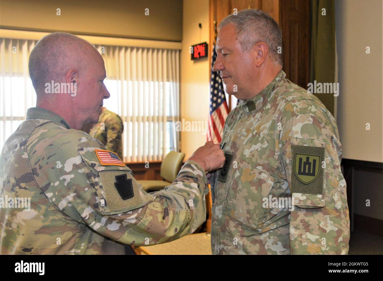 Pennsylvania Adjutant General Maj. Gen. Mark Schindler, left, presents ...