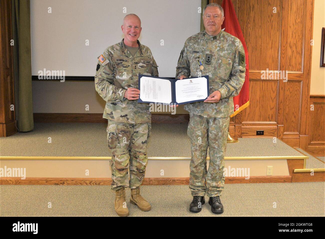 Pennsylvania Adjutant General Maj. Gen. Mark Schindler, left, presents ...