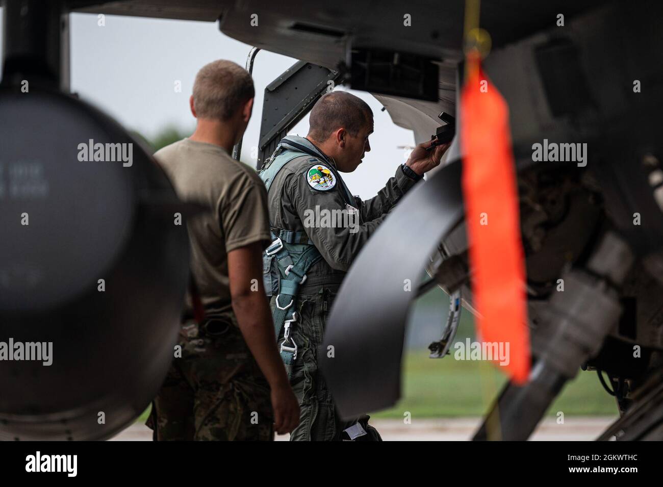 U.S. Air Force 1st Lt. Joshua Utter, right, 112th Fighter Squadron F-16 ...