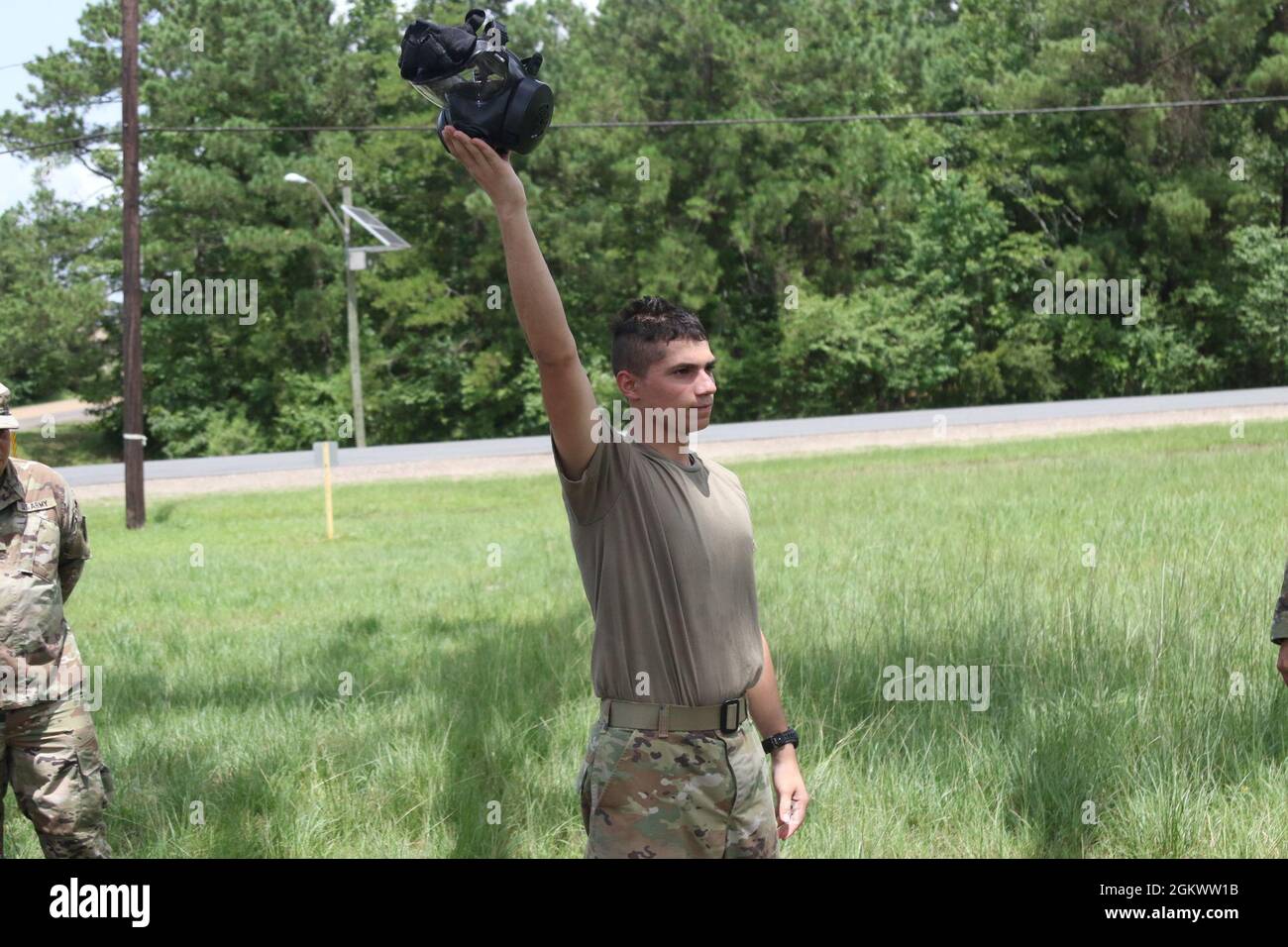 Spc. Alejandro Flores successfully removes his mask during a ...