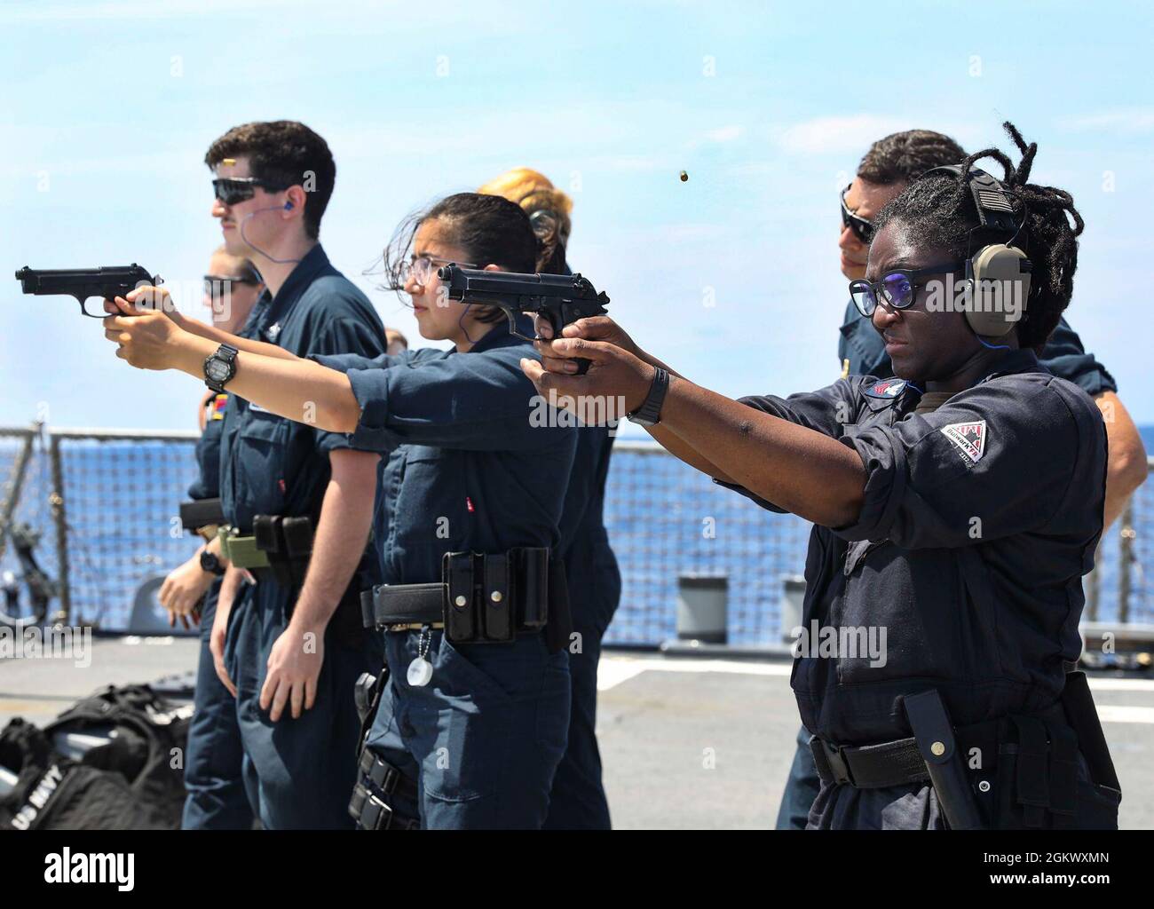 Sailors aboard Arleigh Burke-class guided-missile destroyer USS Benfold ...
