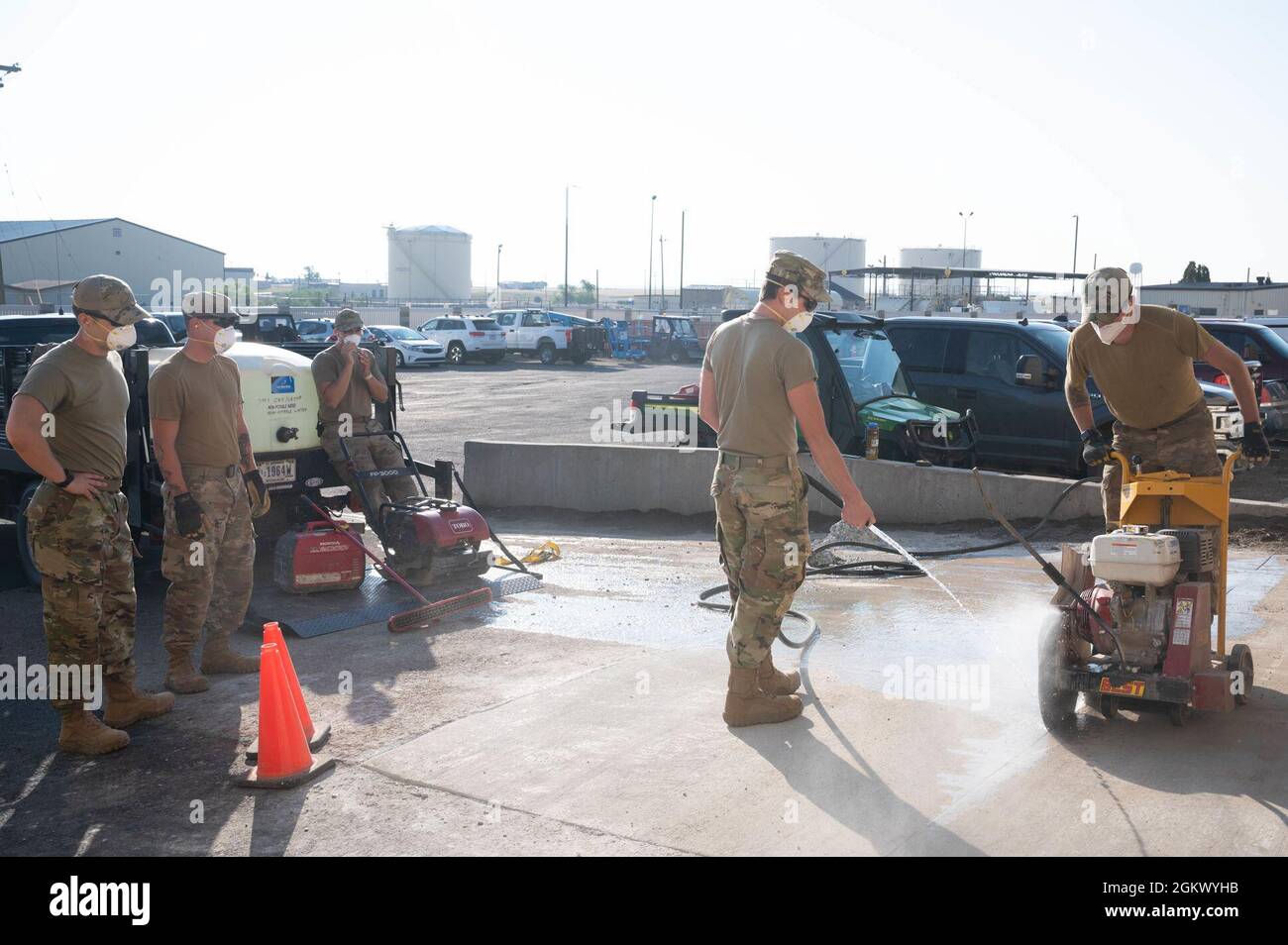Senior Airman Garrett Cothran, center, and Airman 1st Class Christian ...