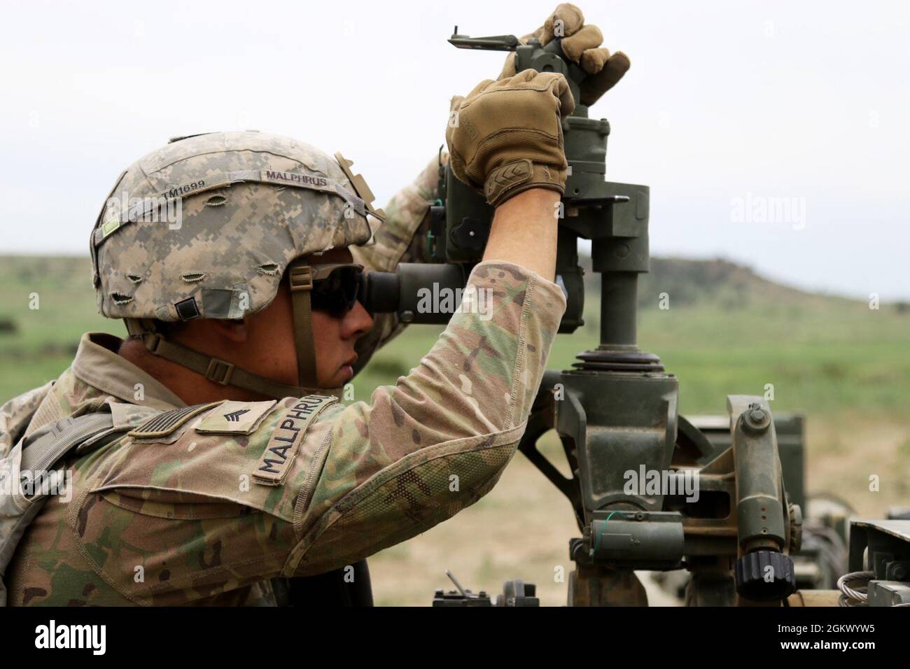 A Soldier with Battery B, 2nd Battalion, 77th Field Artillery Regiment ...