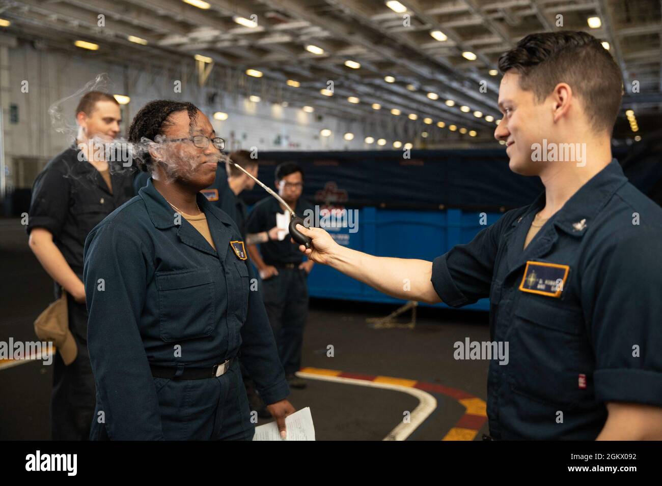 Boatswain's Mate 3rd Class Daniel Roberts, right, from New Orleans ...