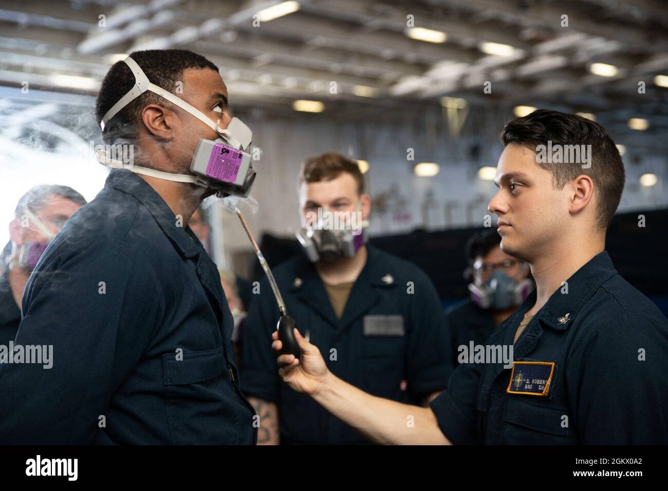 Boatswain's Mate 3rd Class Daniel Roberts, right, from New Orleans ...