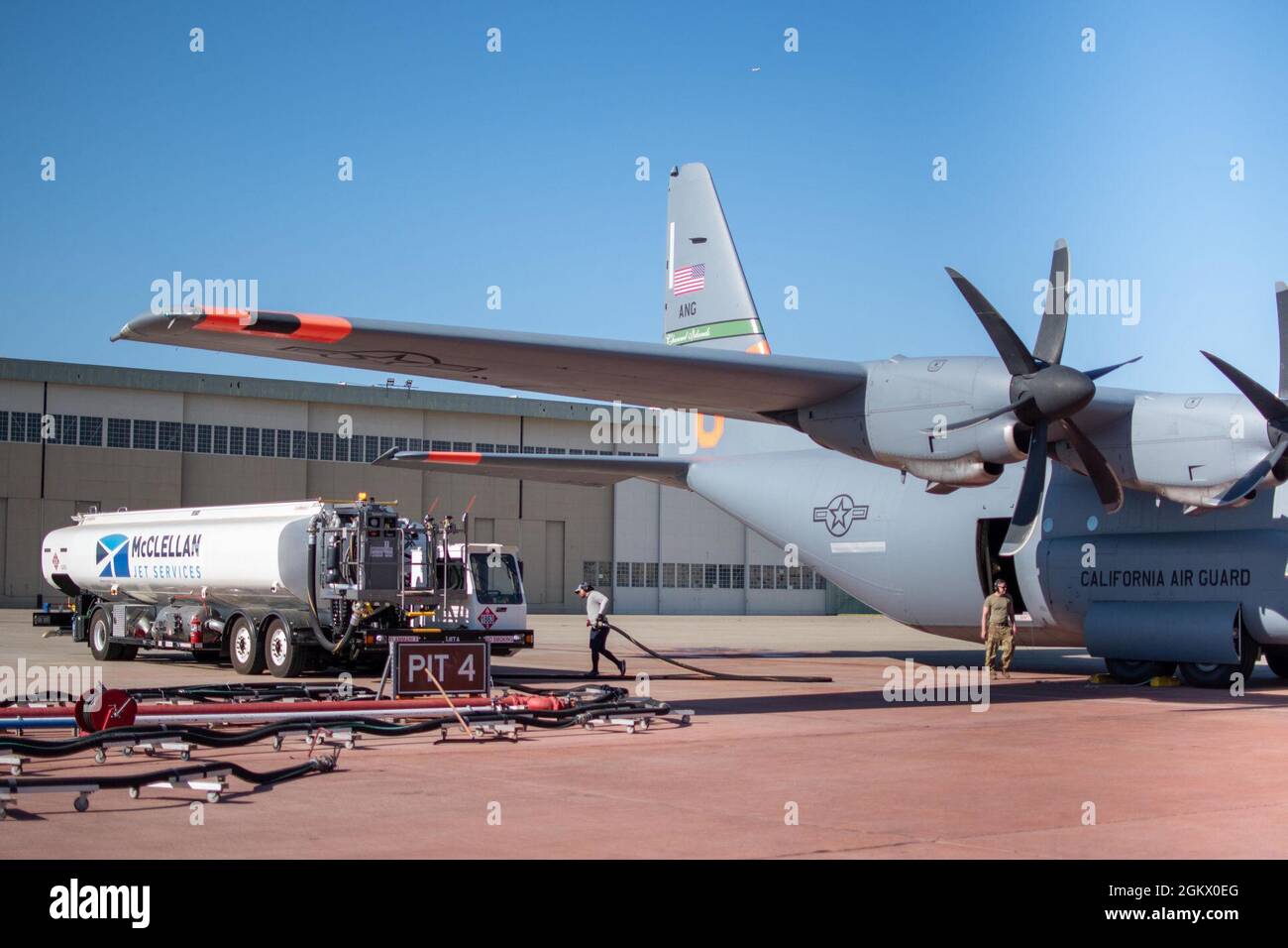 A C-130 out of Channel Islands, Calif. is topped off with fuel before ...