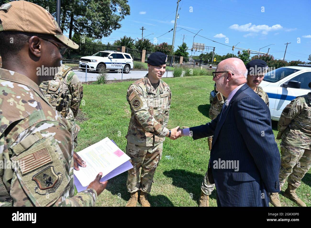 Acting Secretary of the Air Force John P. Roth greets security forces ...
