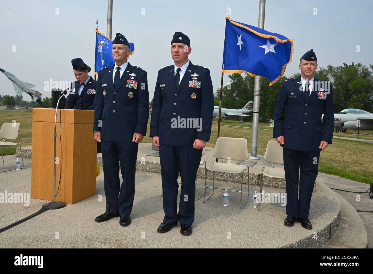 From left to right, Tech. Sgt. Shelly Fink reads the promotion order as ...