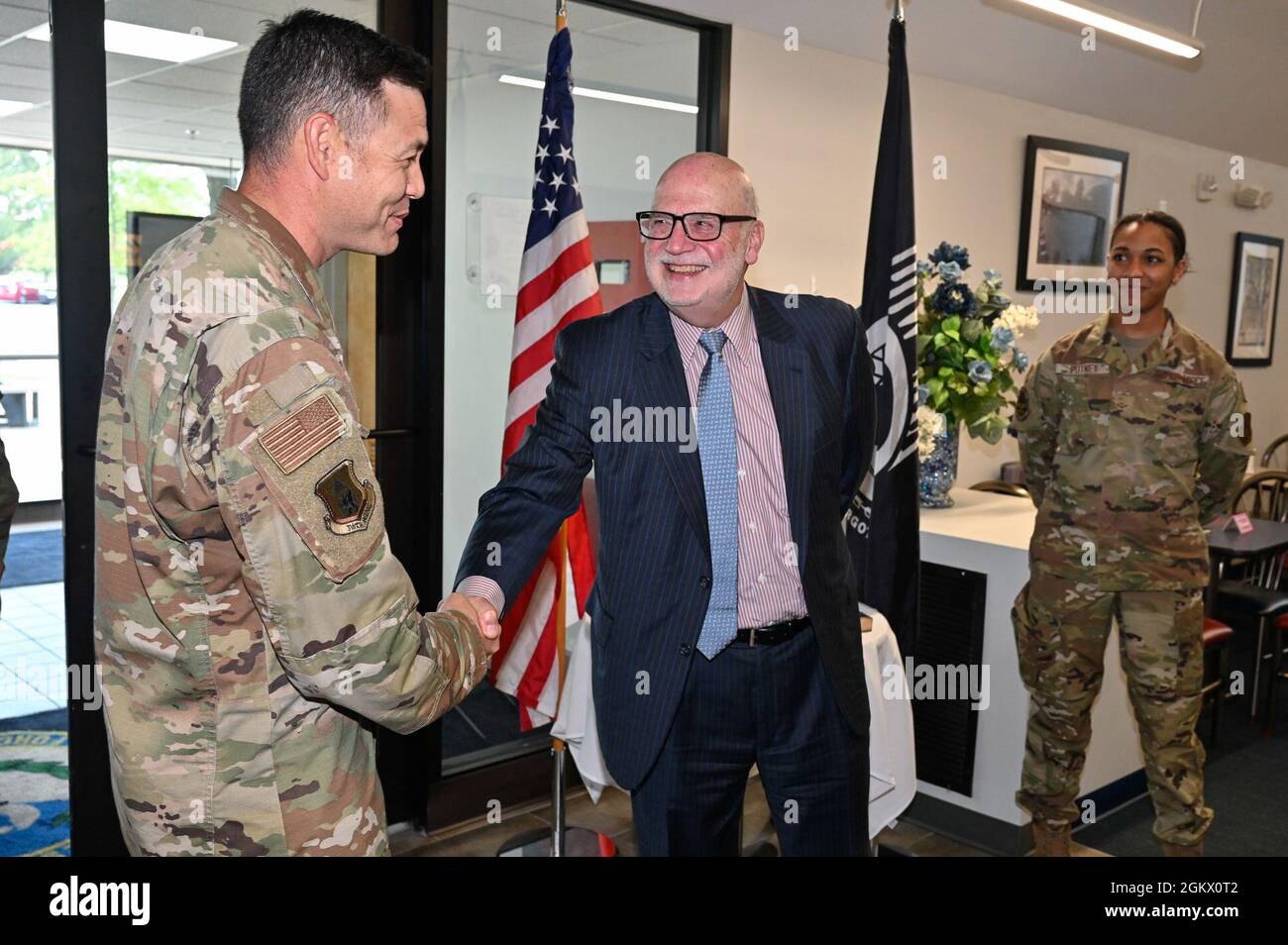 Acting Secretary of the Air Force John P. Roth shakes hands with Lt ...