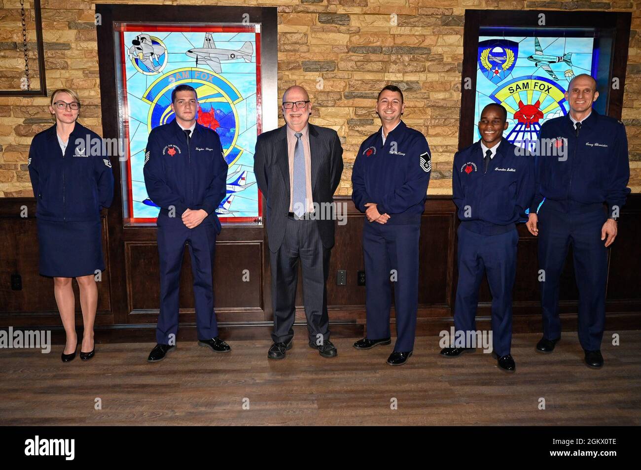 Acting Secretary of the Air Force John P. Roth poses with Airmen ...