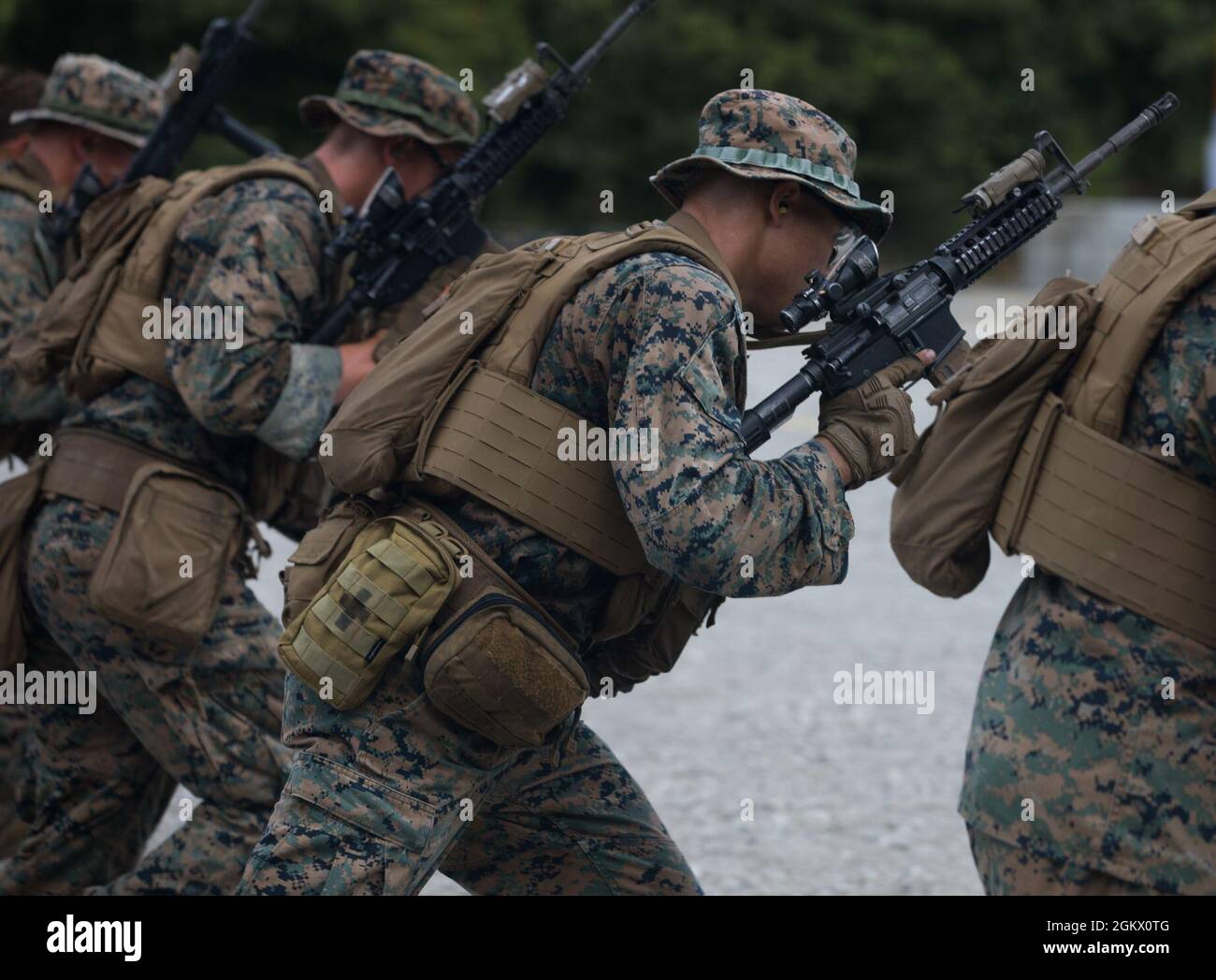 U.S. Marines with 2nd Battalion, 6th Marine Regiment, conduct shooting drills during a live-fire ...