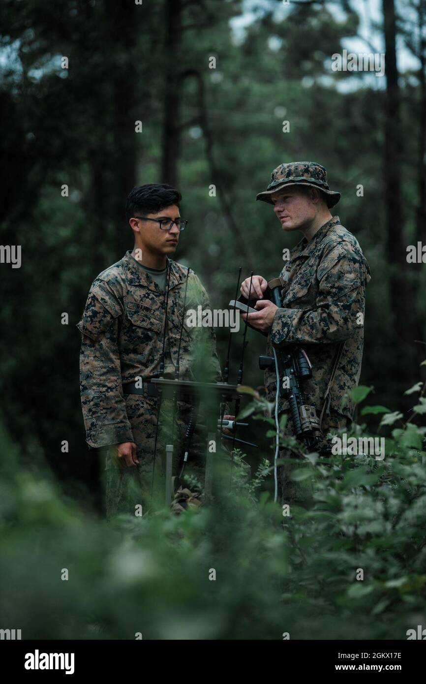 U.S. Marine Corps Cpl. Sebastian Ramirez, left, and Cpl. Kenny Law ...
