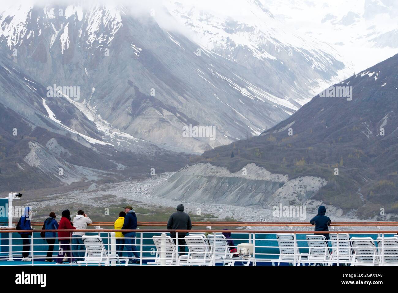 Tourists on the deck of a cruise ship view scenery along the Tarr Inlet ...