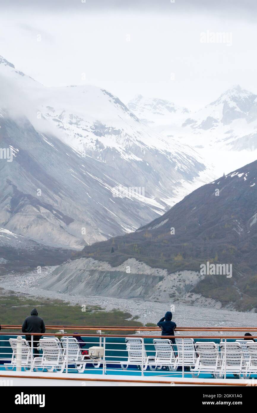 Tourists on the deck of a cruise ship view scenery along the Tarr Inlet ...