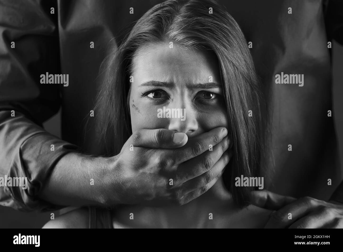 Hand covering womans mouth hi-res stock photography and images - Alamy