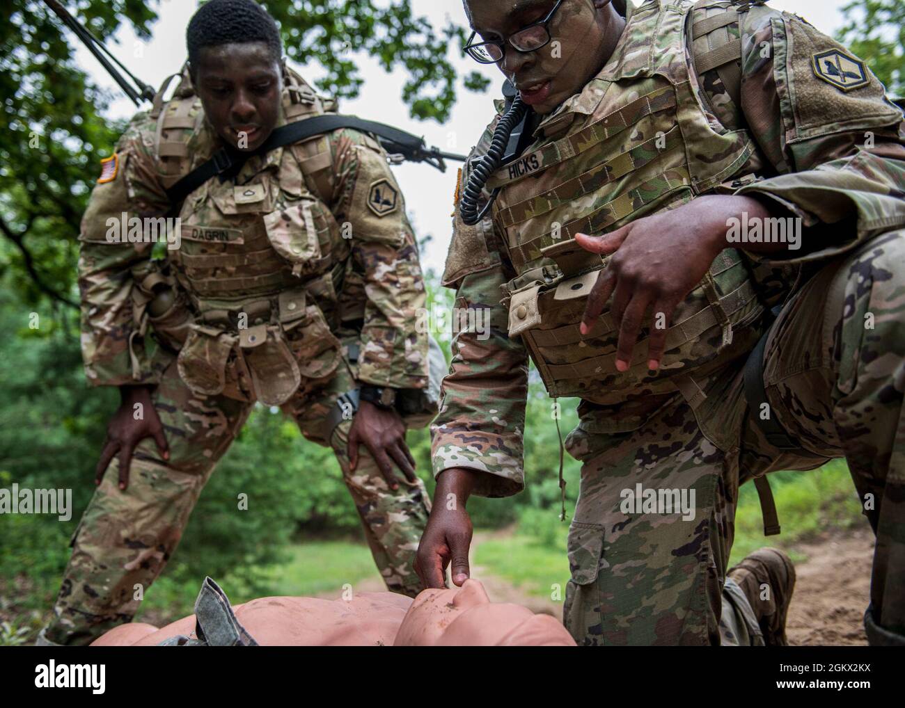U.S. Army Staff Sgt. Hicks, an Intelligence Analyst (right) and Spc ...